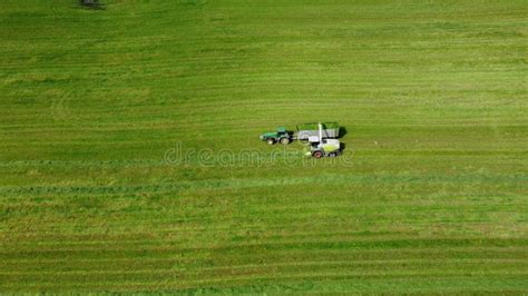 Loading Hay With A Combine Into A Tractor Trailer Stock Video Video Of Feed Rural 258585843