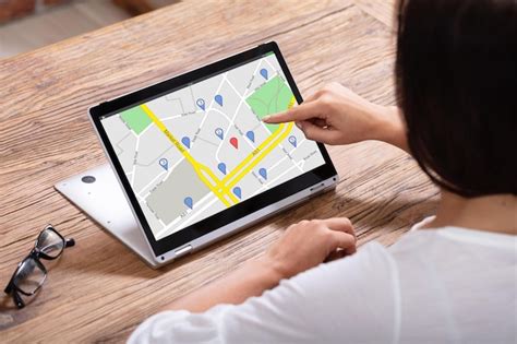 Premium Photo Woman Using GPS Navigation Map On Digital Laptop
