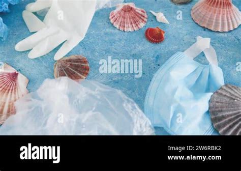 Save The Ocean Text On Blue Background With Sea Shells And Plastic