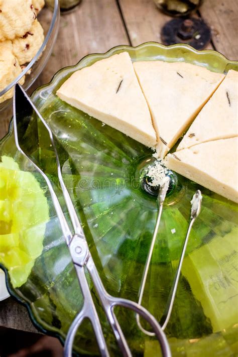 Green Serving Glass Plate With Rosemary Shortbread On Wooden Tab Stock
