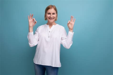 Premium Photo Kind Pleasant Blond Mature Woman With Clean Face At