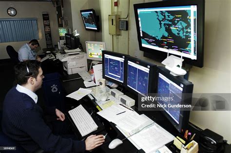 Radarman 1st Class Travis Costigan Talks With A Vessel Approaching