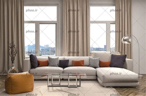 عکس مبل سفید و میز شیشه ای جلوی آن در کنار آباژور و گلدان و پنجره ای رو