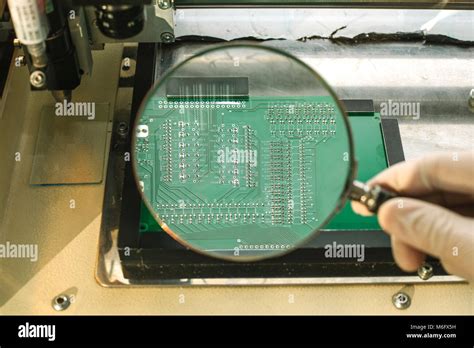Female Computer Expert Professional Technician Examining Board Computer In A Laboratory In A