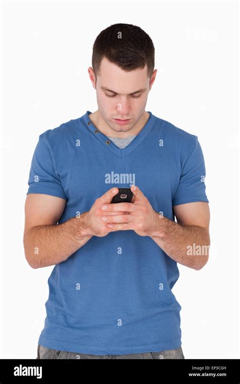 Portrait Of A Smiling Man Sending Text Messages Stock Photo Alamy