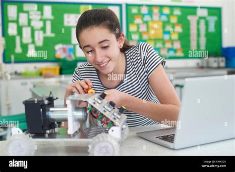 Female Pupil In Science Lesson Studying Robotics Stock Photo Alamy