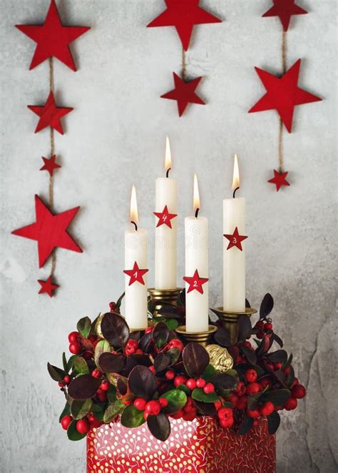 Beautiful Advent Floristic Arrangement Red Checkerberry Plant With Four White Burning Candles