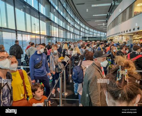 Crowd Of Passengers People Wearing Facemasks Queuing In Vienna Airport Crowded Airport