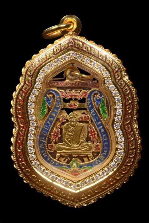 เหรียญหลวงพ่อกลั่น วัดพระญาติ จ อยุธยา เนื้อทองคำ ฉลุ 2 ชั้น ลงยา ราชาวดี สร้างปี 2469 ทางเรา