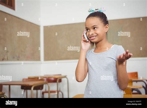 Babe Using A Mobile Phone In Class Stock Photo Alamy