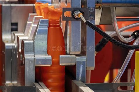 The Orange Bottle Container Manufacturing Process By Blow Mold Machine