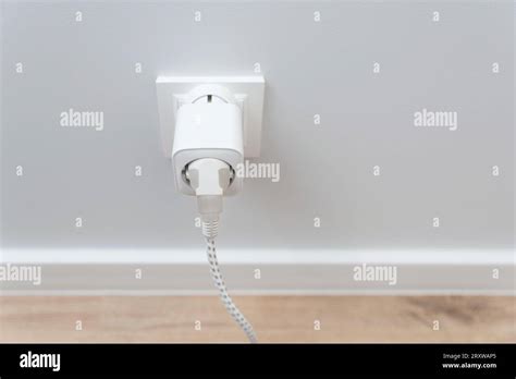 Using Wi Fi Smart Socket On The Wall In A Smart Home Controlling Electricity Consumption Stock
