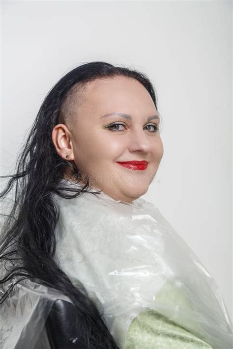 Smiling With Half Shaved Head Brunette Woman With Bright Makeup In Barber Chair Stock Image