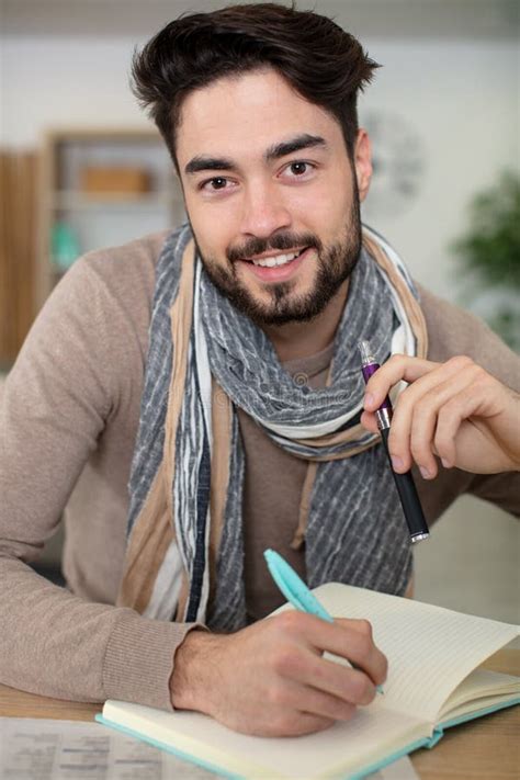 Handsome Young Man Writing Something In Note Pad Stock Image Image Of