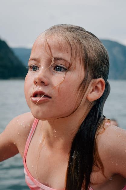 Premium Photo Close Up Of Wet Girl At Beach Against Sky
