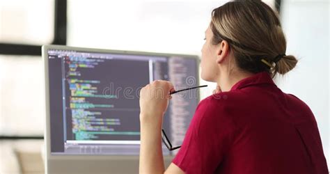 Programmer With Glasses In Hand Checkups Code On Computer Stock Video