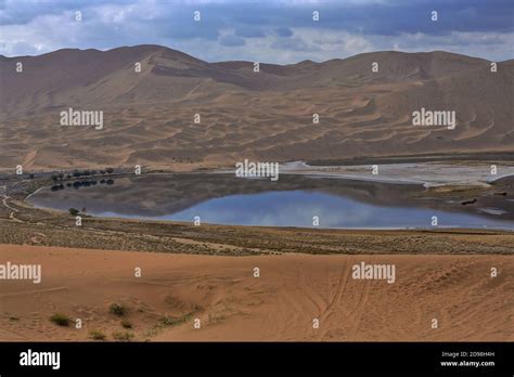 Yinderitu Yindeertu Lake Among Dunes Mirroring Dark Water Badain Jaran
