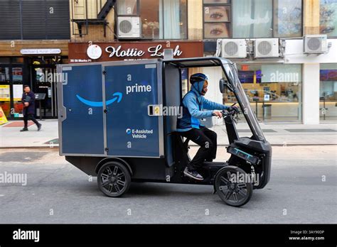 An Amazon Branded Mubea U Mobility 4 Wheeled Electric Cargo Bike On A