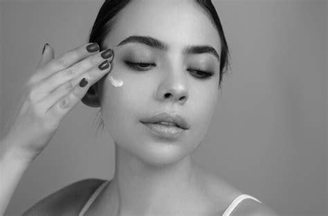 Premium Photo Close Up Facial Cream On Cheek Beauty Portrait Of A Beautiful Half Naked Woman