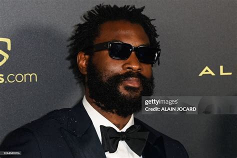 Belgian Rapper Damso Poses Upon Arrival To Attend The 2022 Ballon