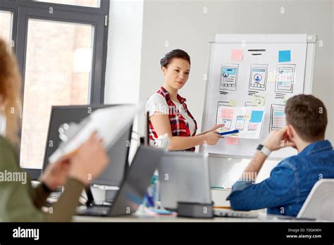 Creative Woman Showing User Interface At Office Stock Photo Alamy