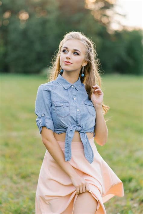 Happy Caucasian Young Woman Girl Walking In The Summer Outdoors In