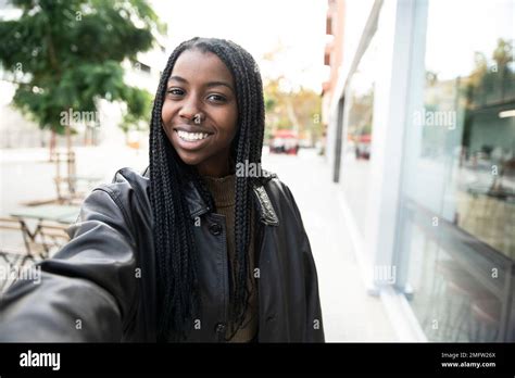 Happy Young Woman Smiling Taking A Selfie Portrait In The City