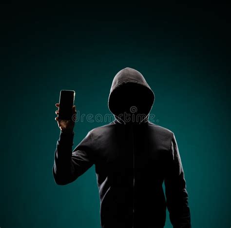 Computer Hacker In Hoodie Obscured Dark Face Data Thief Internet Fraud Darknet And Cyber