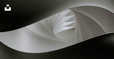 A White Spiral Shaped Object On A Black Surface Photo Free Digital Image Image On Unsplash