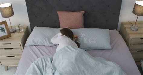 Tired Lazy And Woman Sleeping In Bed For Rest On A Weekend Morning At