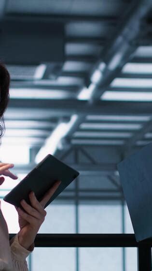 Vertical Colleagues In Data Center Workplace Use Laptop To Calibrate Energy Usage Server Farm