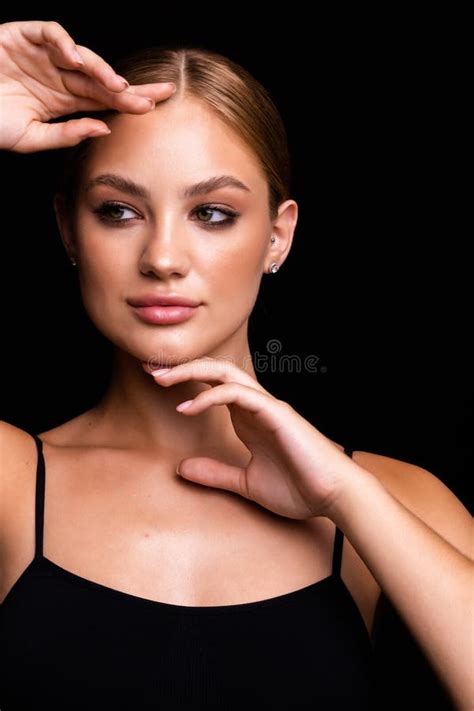 Beautiful Young Brunette Woman With Clean Fresh Skin With Nude Makeup