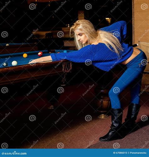 Portrait Of Sexual Blonde Woman With Cue Plays Billliard Stock Image