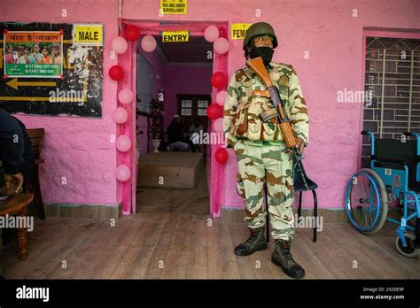 Indian Paramilitary Trooper Is Deployed Outside A Polling Station