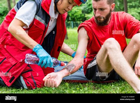 Medical Worker Treating Burns On Man S Arm Stock Photo Alamy