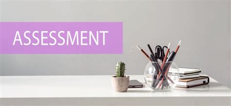 Assessment â€ Text On The Background Of The Office Table Business