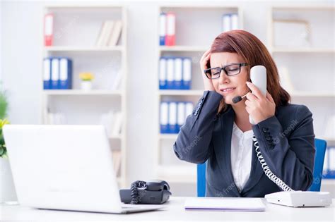 Premium Photo Frustrated Call Center Assistant Responding To Calls