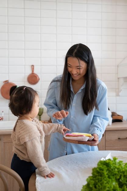 Free Photo Young Asian Girl In The Kitchen At Home