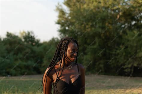 Premium Photo Young Black Female Posing With Style And Looking Down