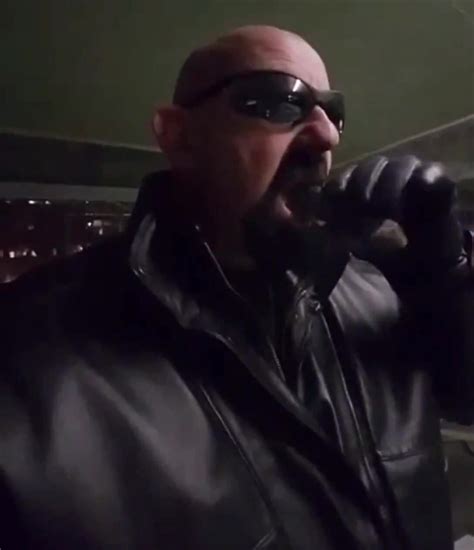 Handsome Bald Leather Master Smoking Cigar Wearing Leat