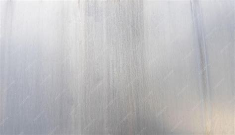 A Silver Metal Surface With A Light Reflection Premium Photo