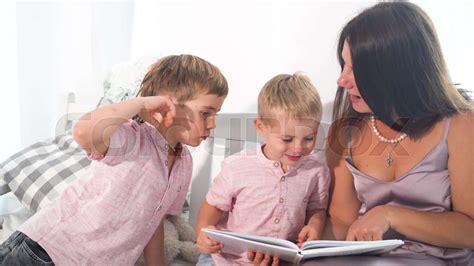 Mother Reading Book To Her Sons Stock Video Colourbox