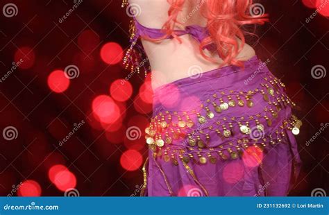 Belly Dancer Wearing Purple Dance Costume Close Up With Bokeh Stock