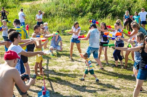 Premium Photo | Children playing water battle water game battle