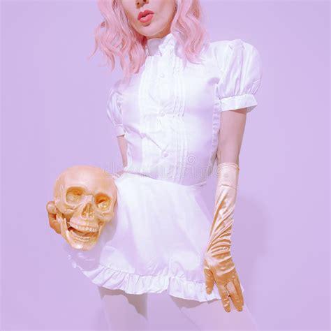 Candy Blonde Girl In A Waiter Costume With Gold Skull Role Playing