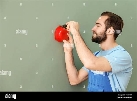 Electrician Installing Alarm Bell Stock Photo Alamy