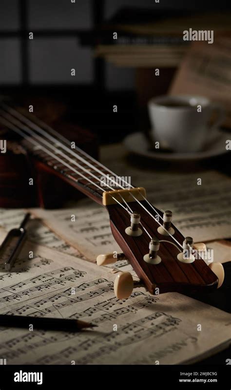 The Ukulele Musical Instrument Was Photographed Against A Dark
