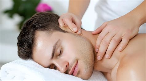 Therapist S Hands Massaging Client S Shoulders In Serene Spa Setting