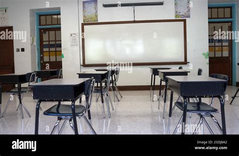 Motion To The Left Showing Empty School Classroom Side View With Chairs Under Stock Video