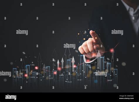 Businessman Analyzing Financial Growth Charts And Pointing At Rising Bar Graphs Marketing With